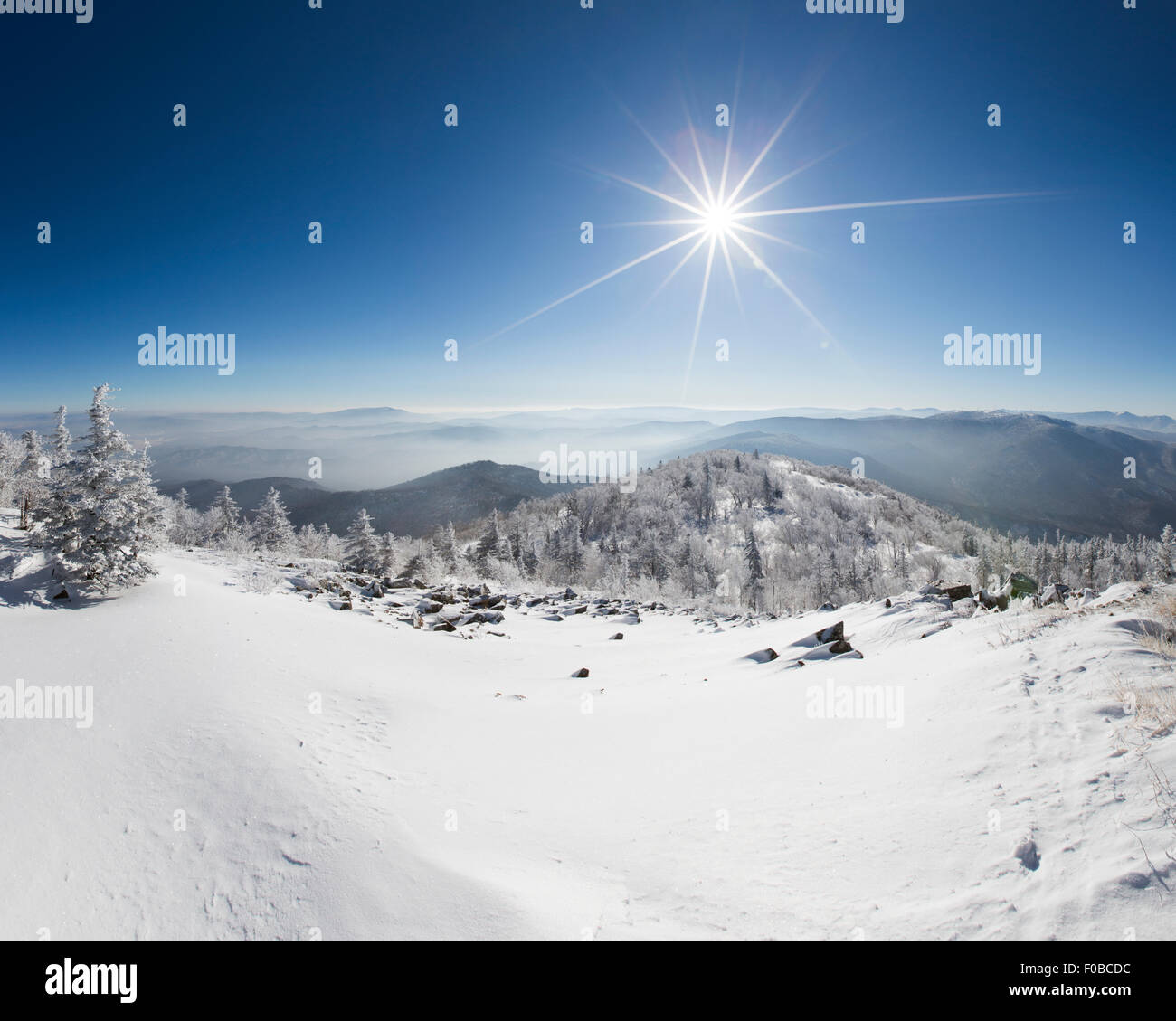 Sun shining on snow, China Stock Photo - Alamy