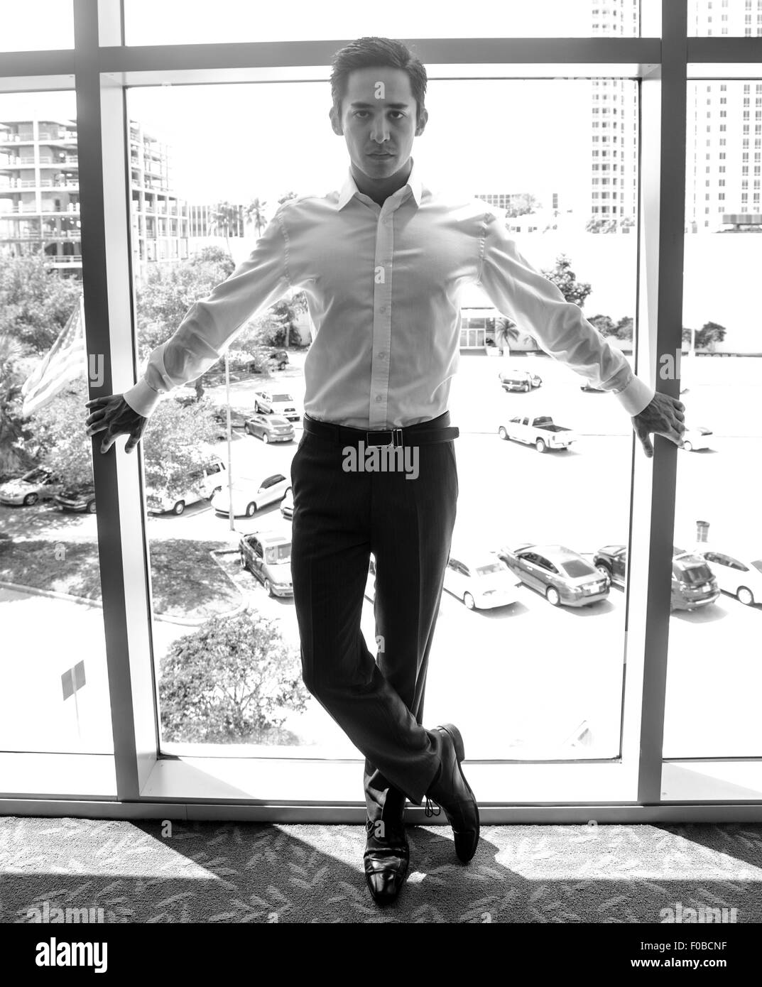 Asian Man in Library wearing suit Stock Photo - Alamy