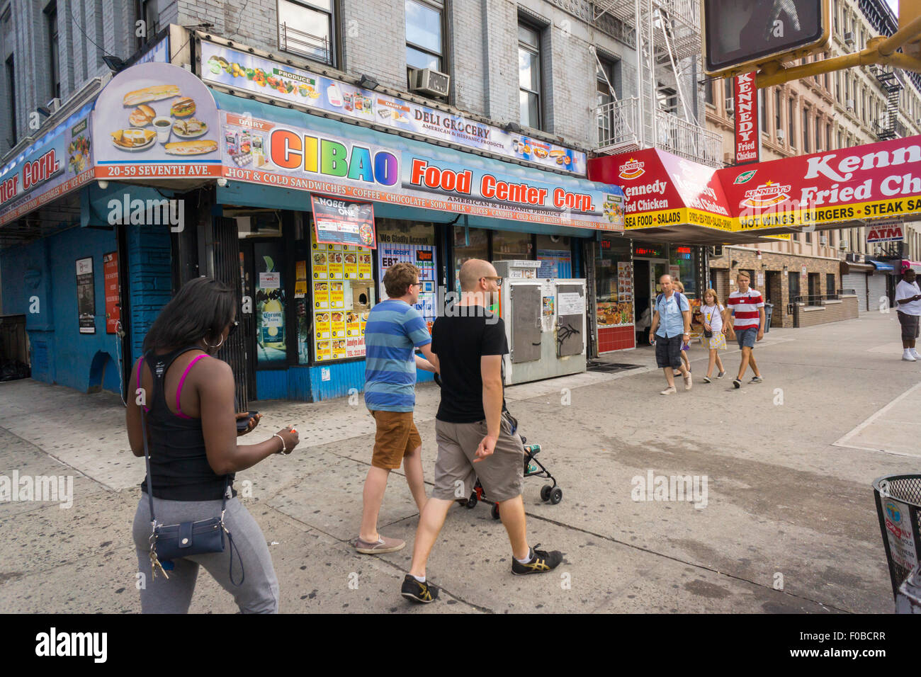 A bodega next to a Kennedy Fried Chicken in the neighborhood of Harlem ...