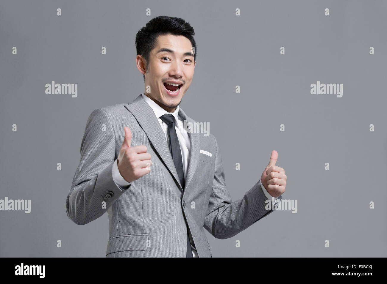 Happy young businessman Stock Photo - Alamy