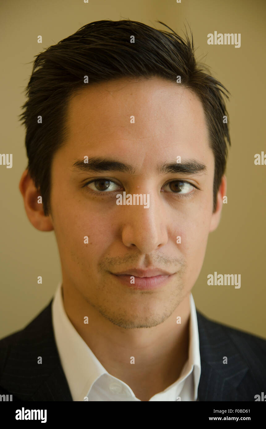 Asian Man in Library wearing suit Stock Photo - Alamy