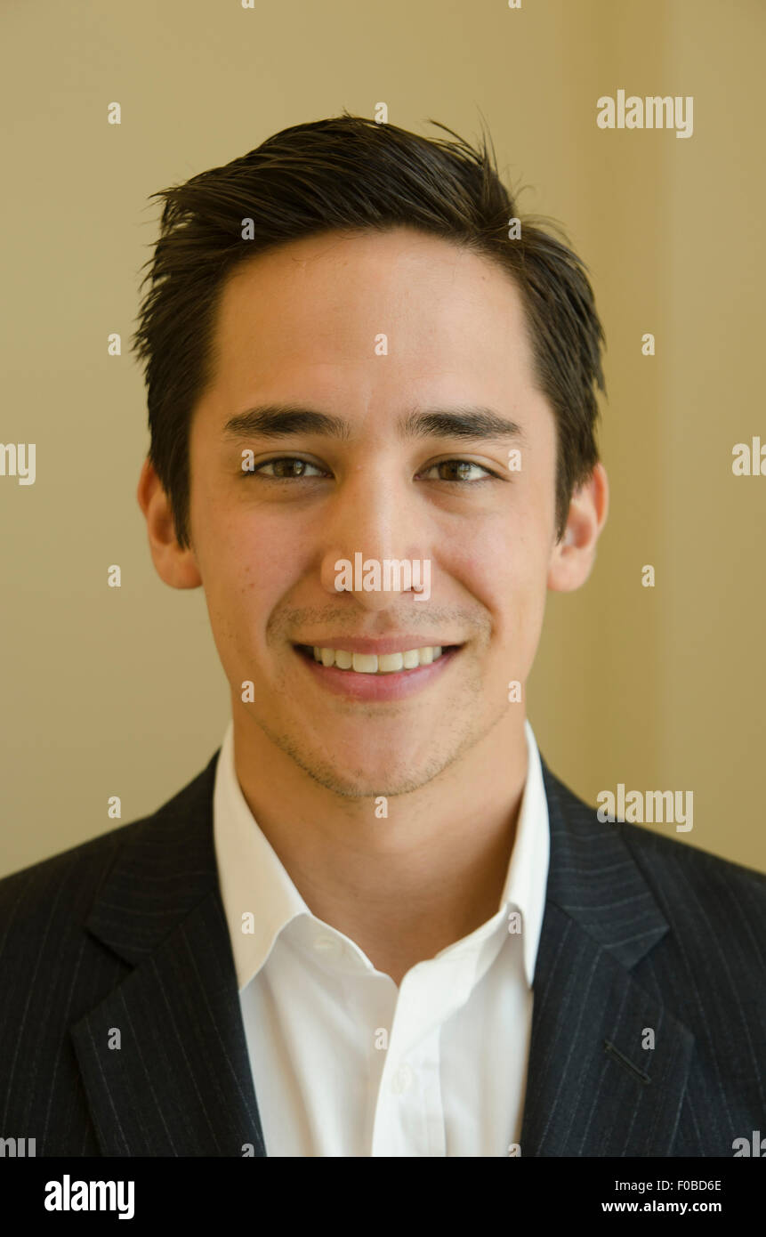 Asian Man in Library wearing suit Stock Photo - Alamy