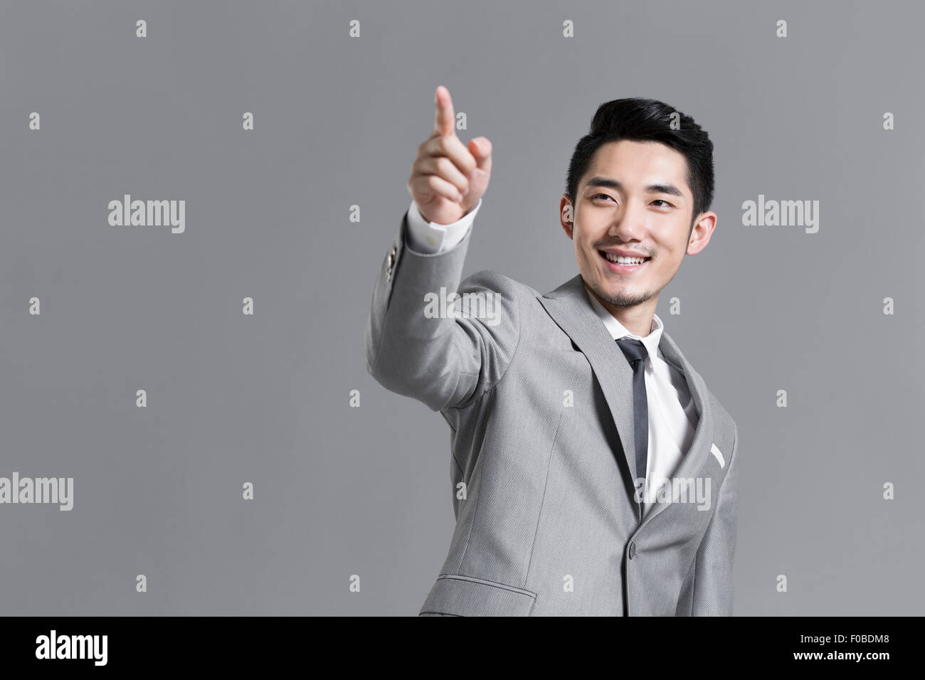 Happy young businessman Stock Photo - Alamy