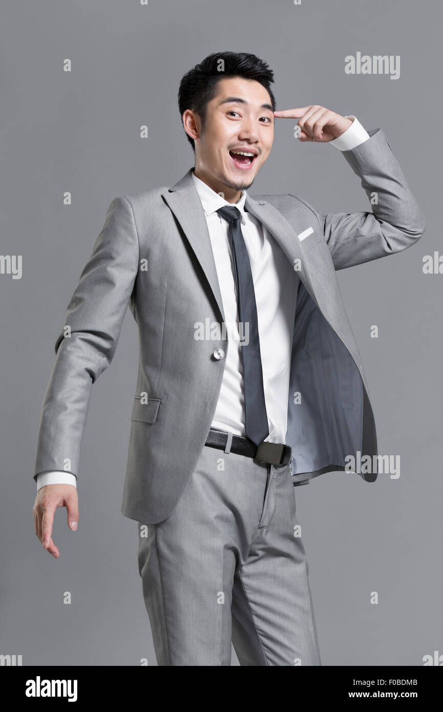 Happy young businessman Stock Photo - Alamy