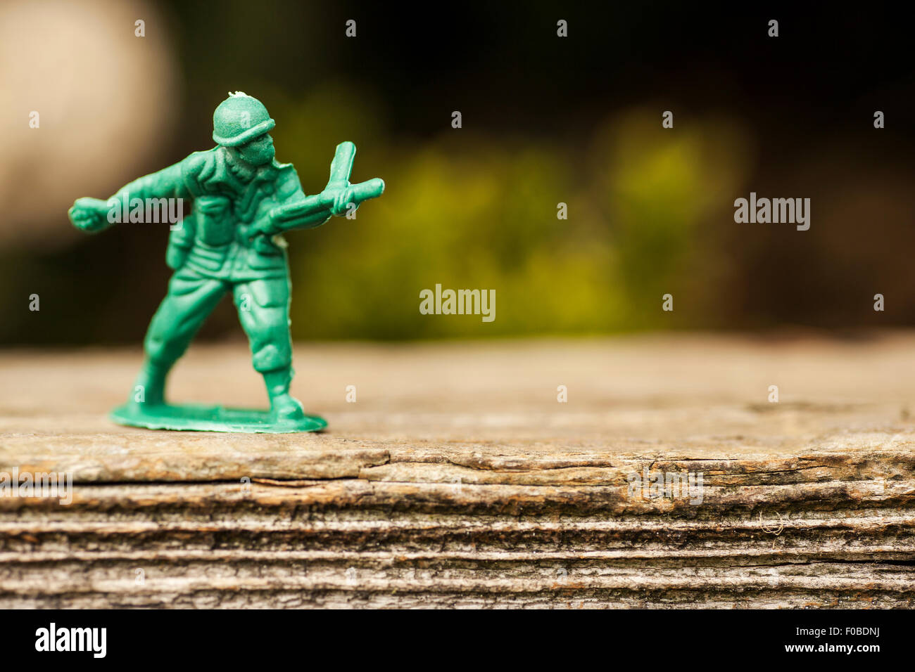 Green plastic toy soldiers/army men on a mission in the back garden ...