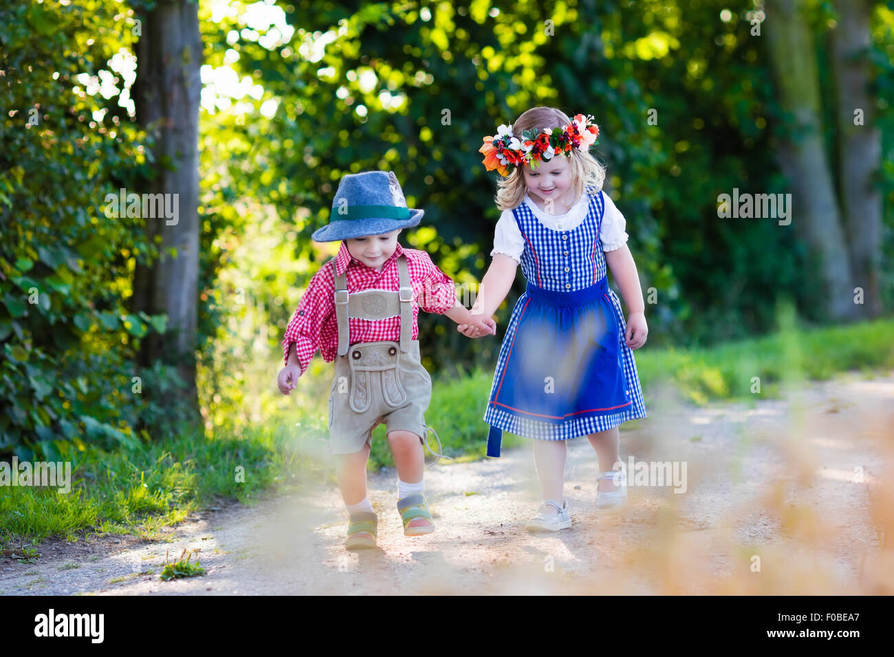 Kids in traditional Bavarian costumes in wheat field. German children ...