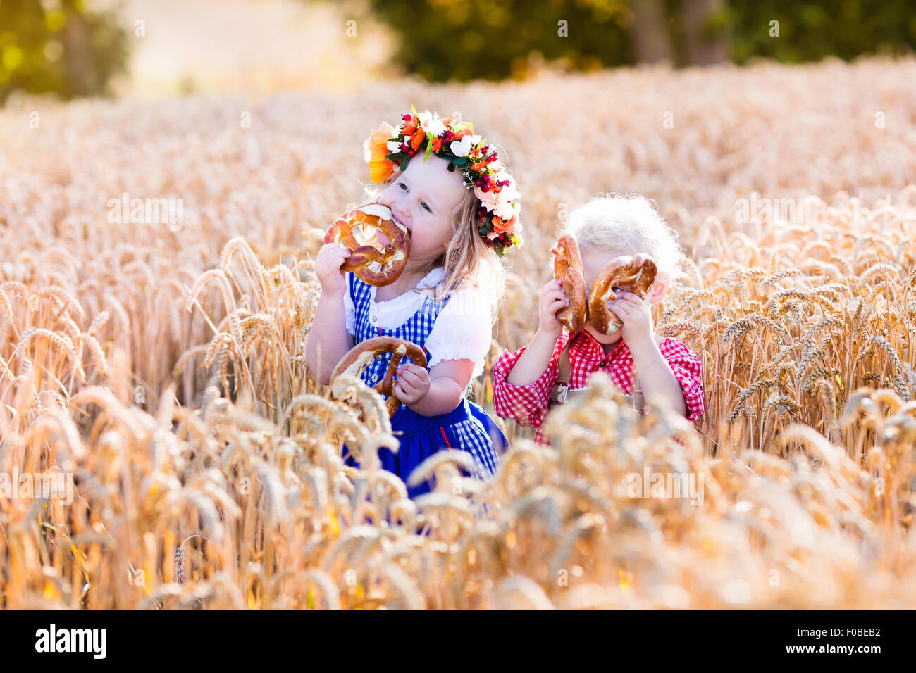 Kids in traditional Bavarian costumes in wheat field. German children ...