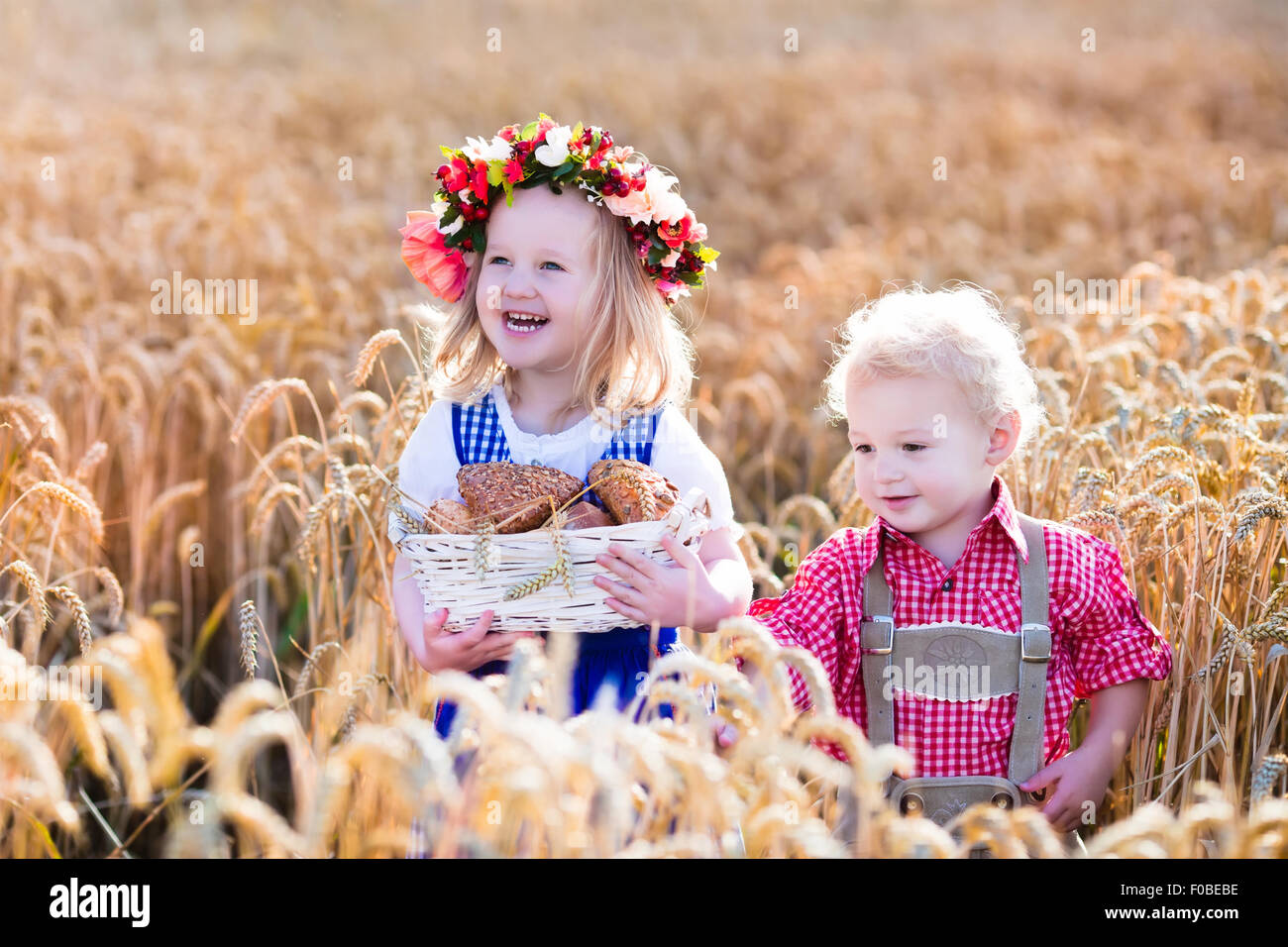 Kids in traditional Bavarian costumes in wheat field. German children ...