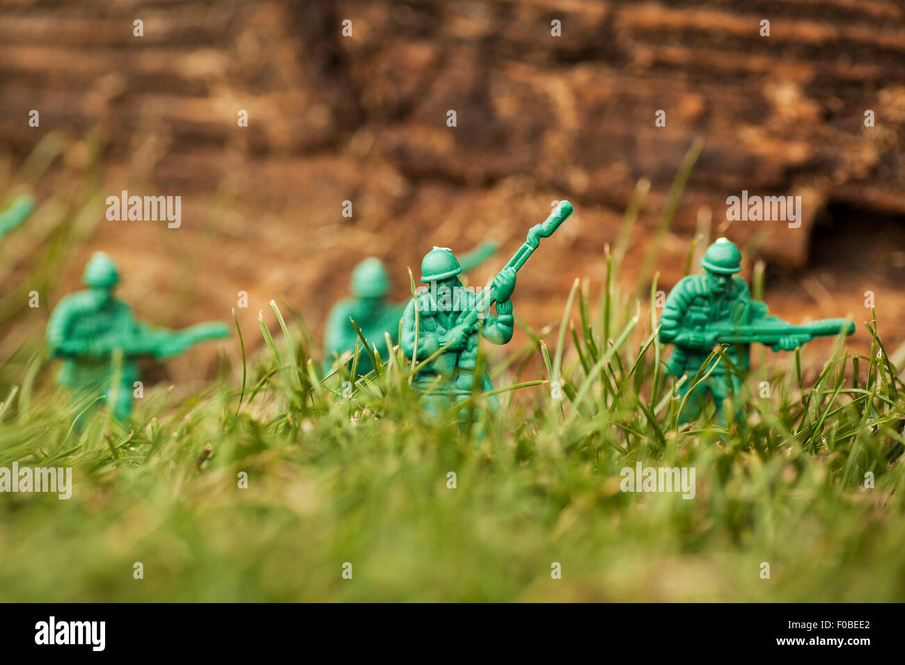 Green plastic toy soldiers/army men on a mission in the back garden ...