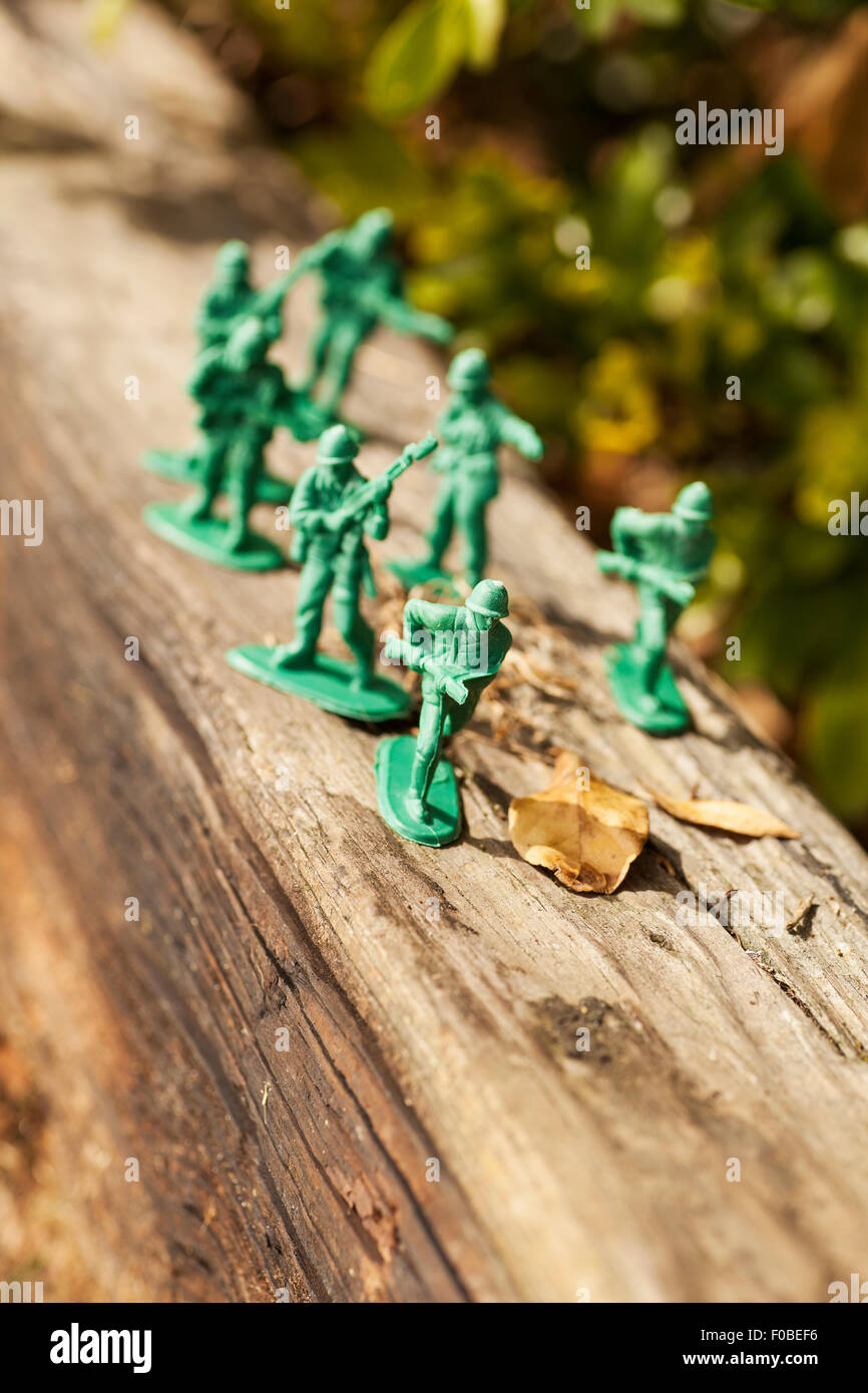 Green plastic toy soldiers/army men on a mission in the back garden ...