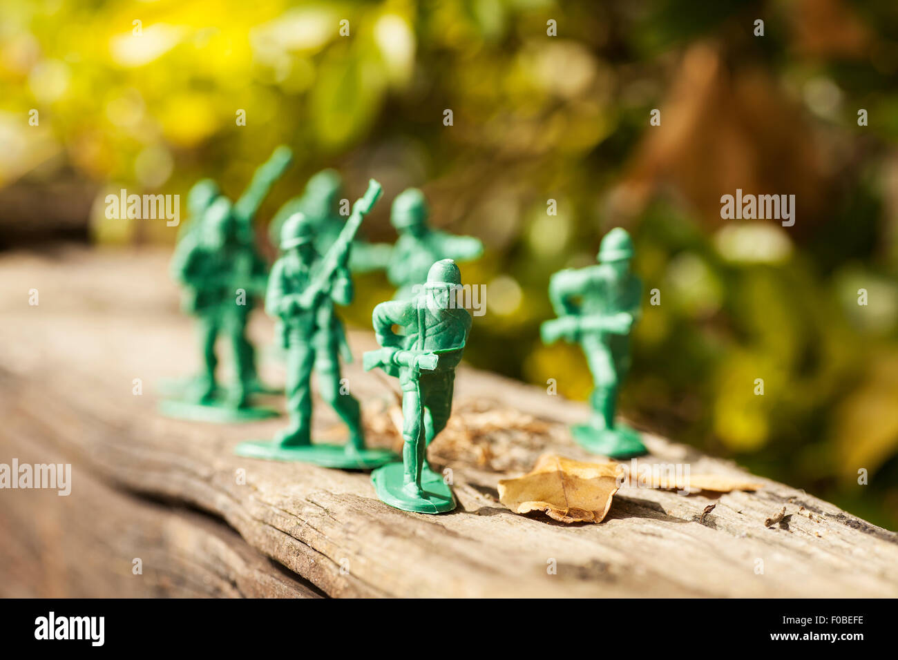 Green plastic toy soldiers/army men on a mission in the back garden ...