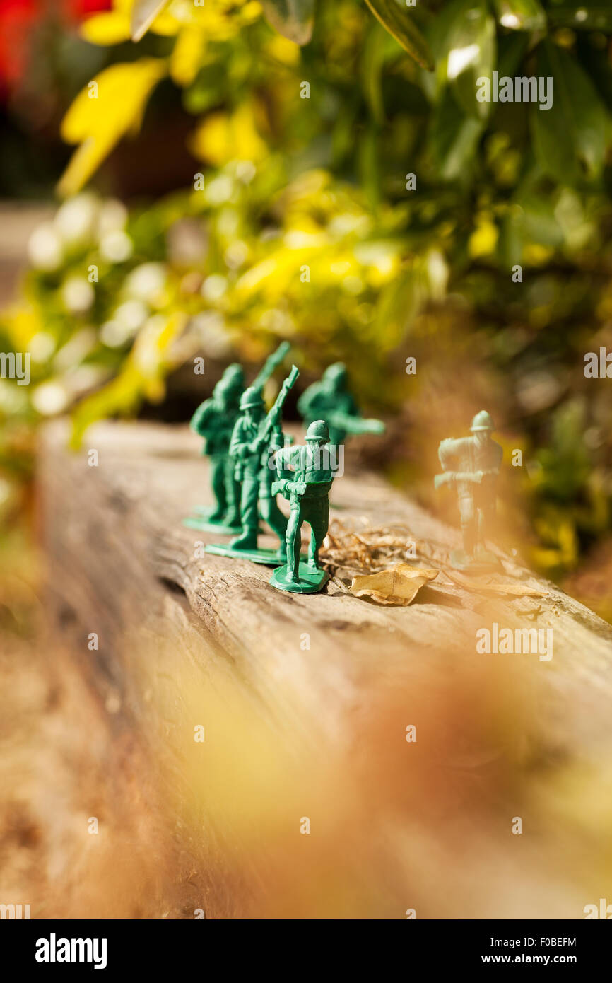 Green plastic toy soldiers/army men on a mission in the back garden ...