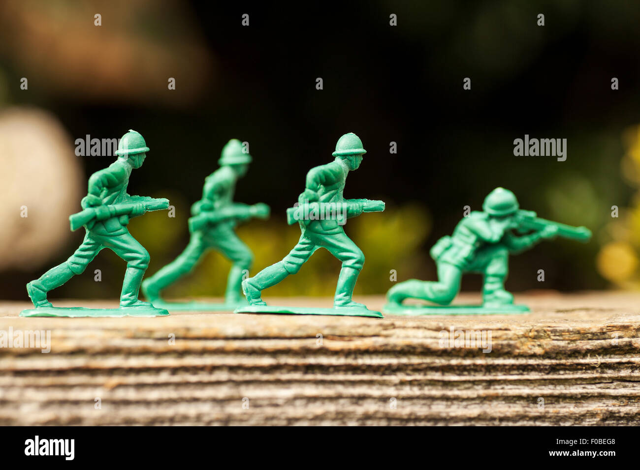 Green plastic toy soldiers/army men on a mission in the back garden ...