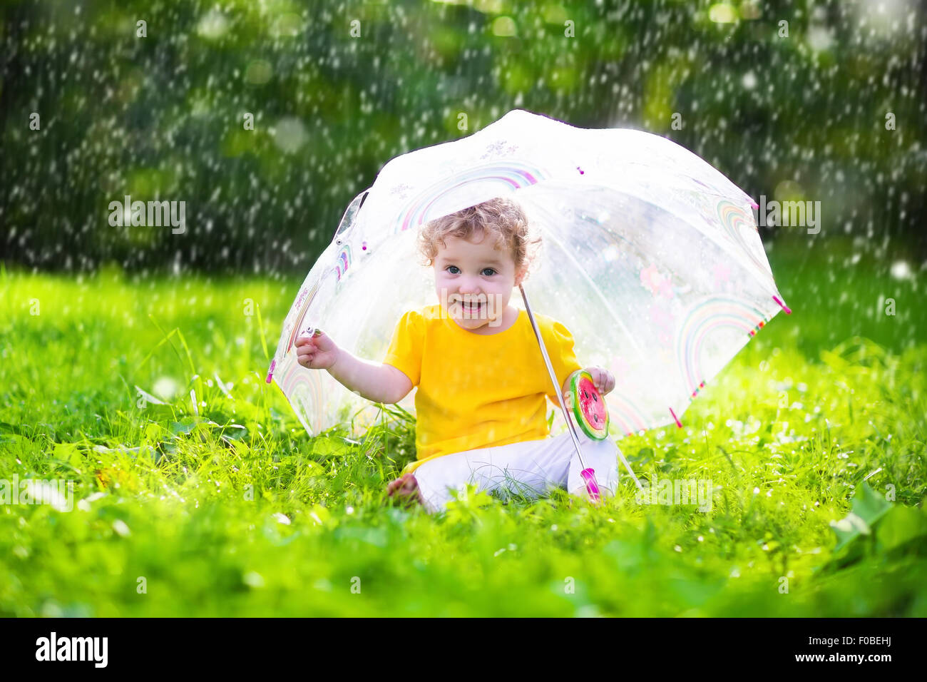 Little Girl Sitting In The Rain