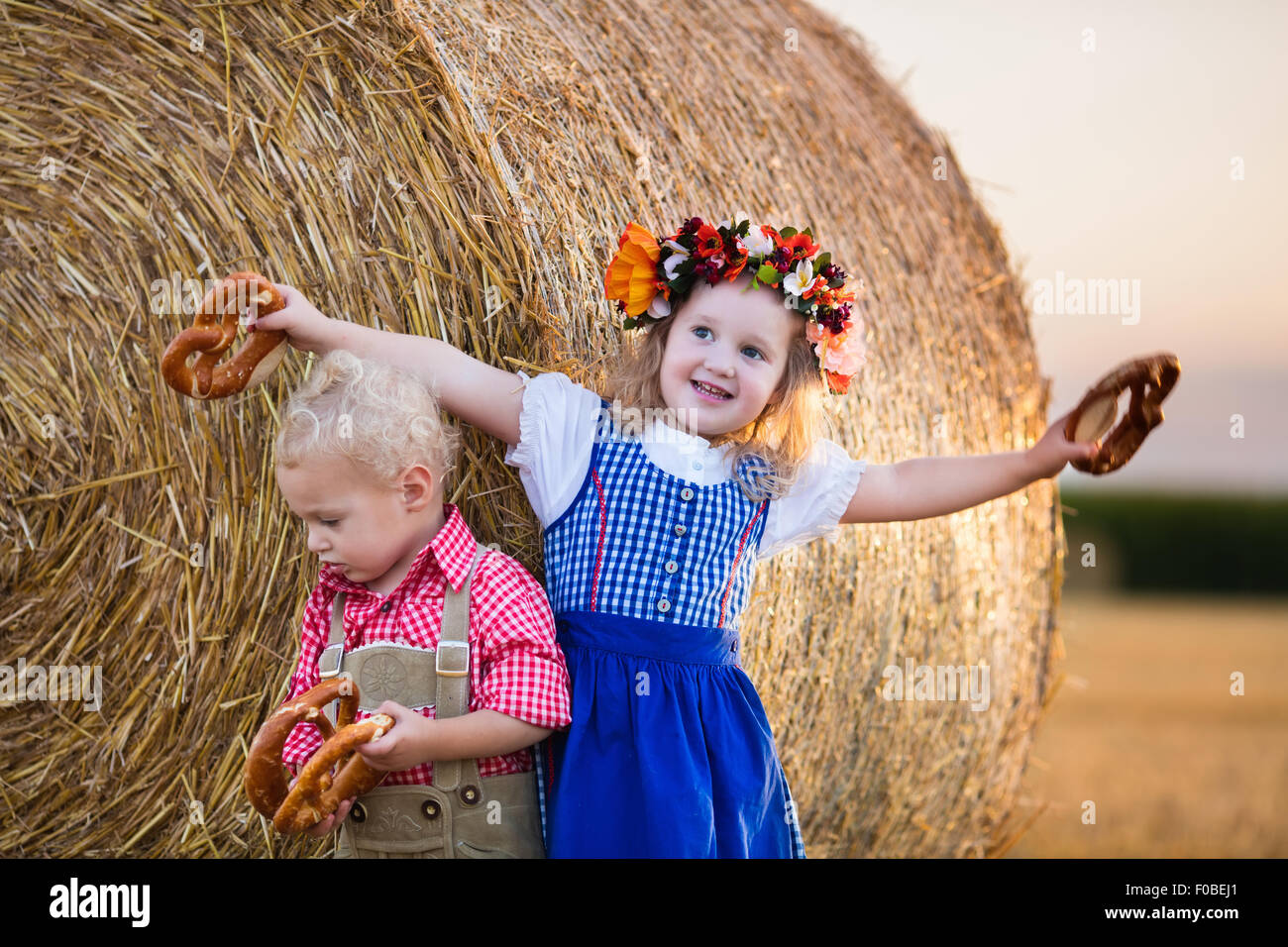 Kids in traditional Bavarian costumes in wheat field. German children ...