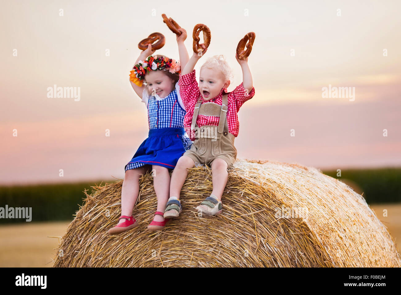 Kids in traditional Bavarian costumes in wheat field. German children ...