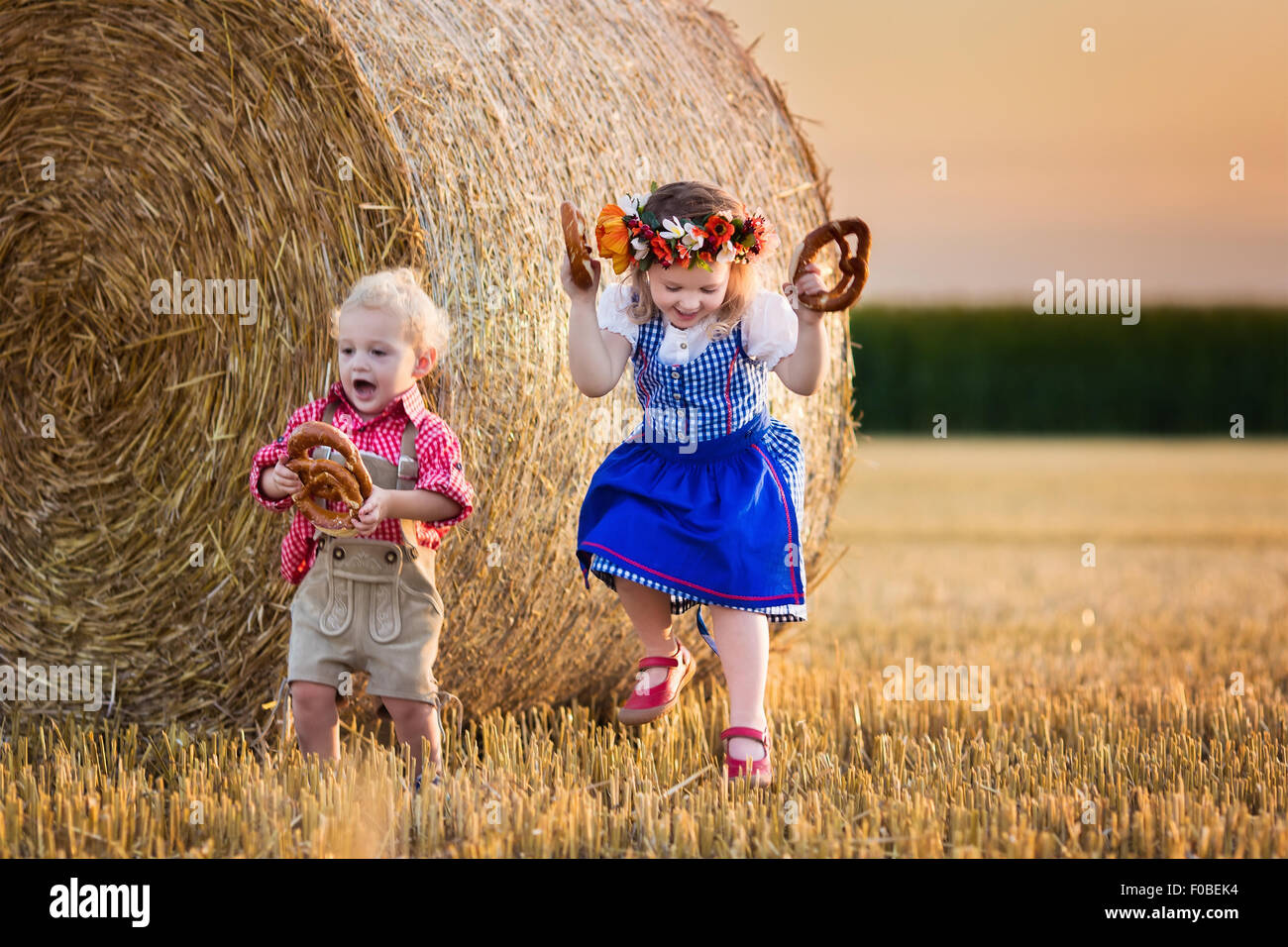 Kids in traditional Bavarian costumes in wheat field. German children ...