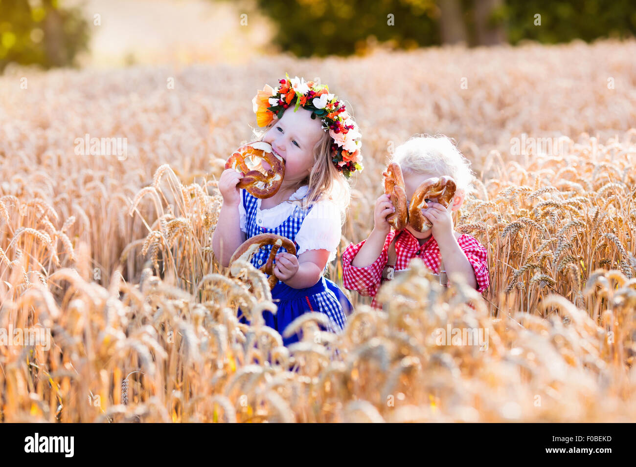 Kids in traditional Bavarian costumes in wheat field. German children ...