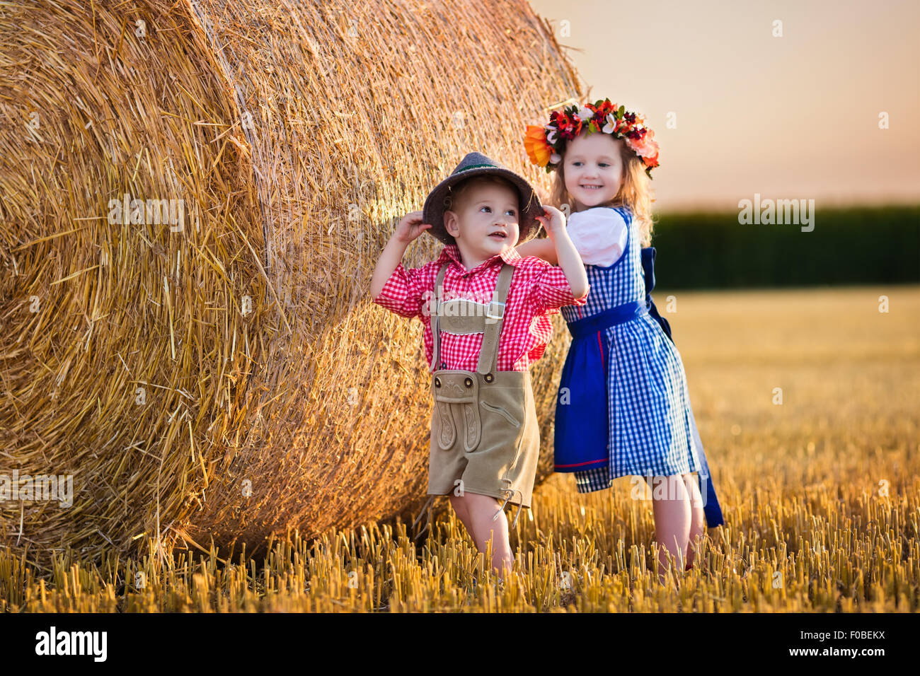 Kids in traditional Bavarian costumes in wheat field. German children ...