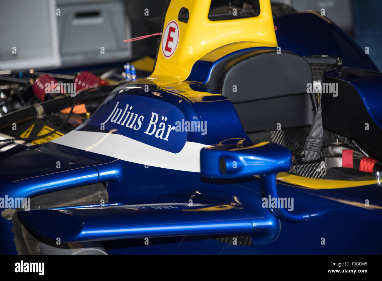 Mechanics working on Formula E racing cars during a break in testing at ...