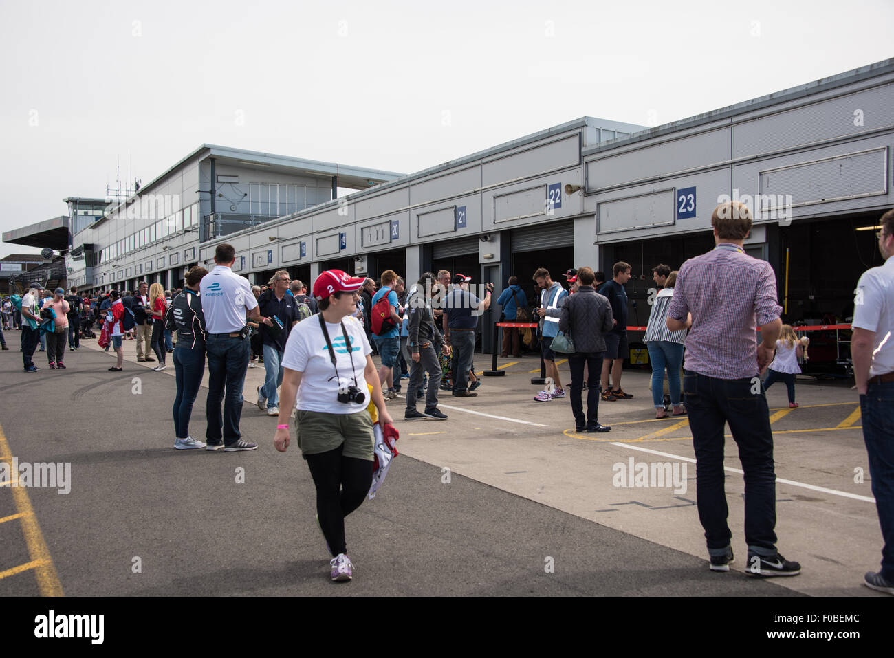 Members of the public walking about in the pits during a break in ...