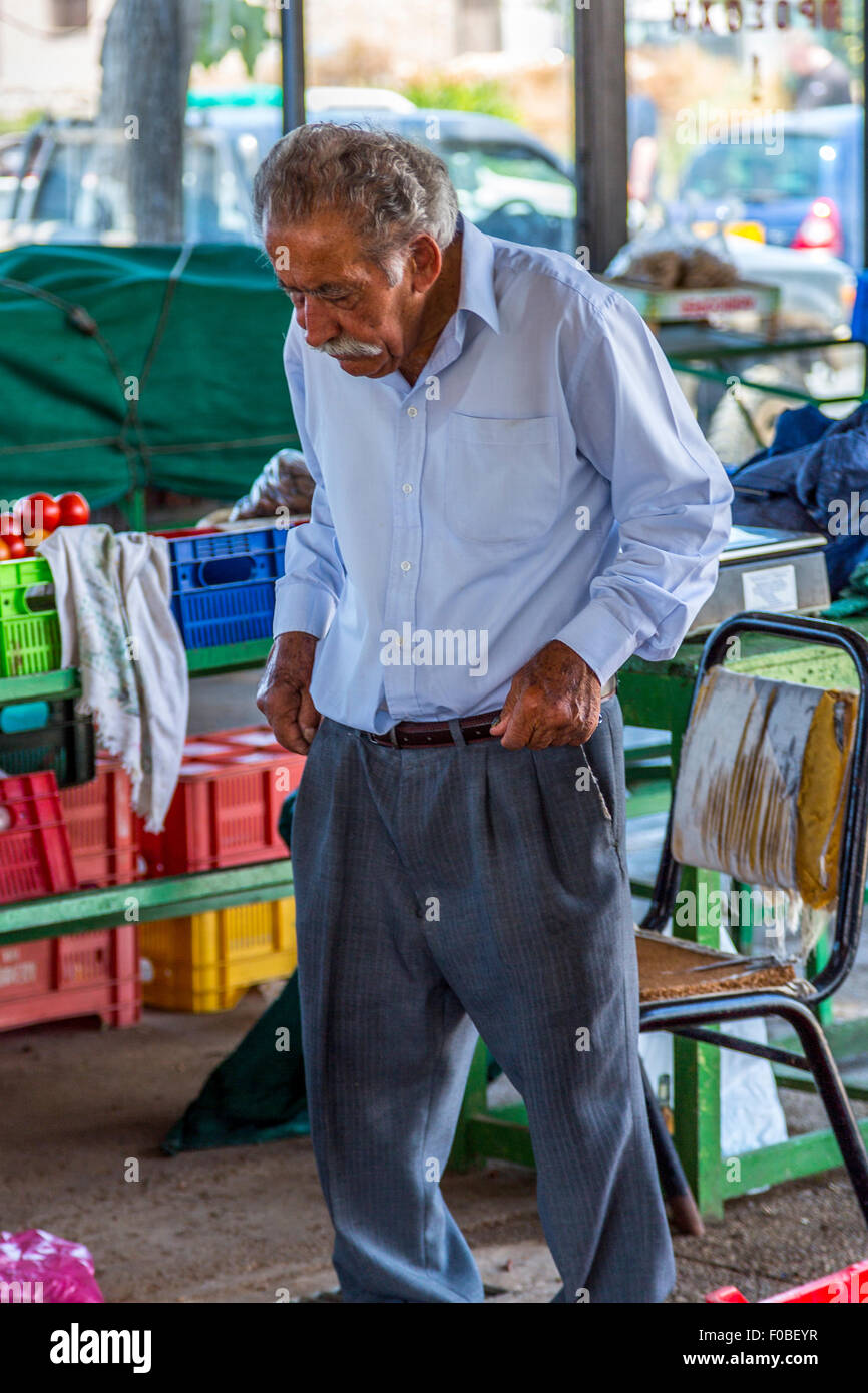 Old man market stall holder in the market in Paphos Old Town, Cyprus ...