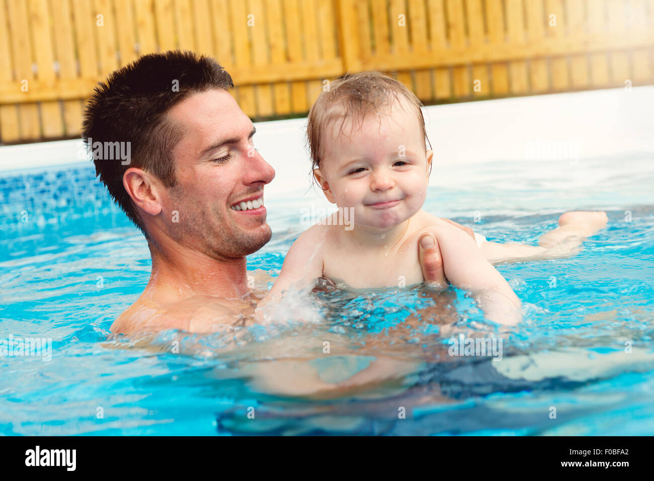 Father and son in swimming pool hi-res stock photography and images - Alamy