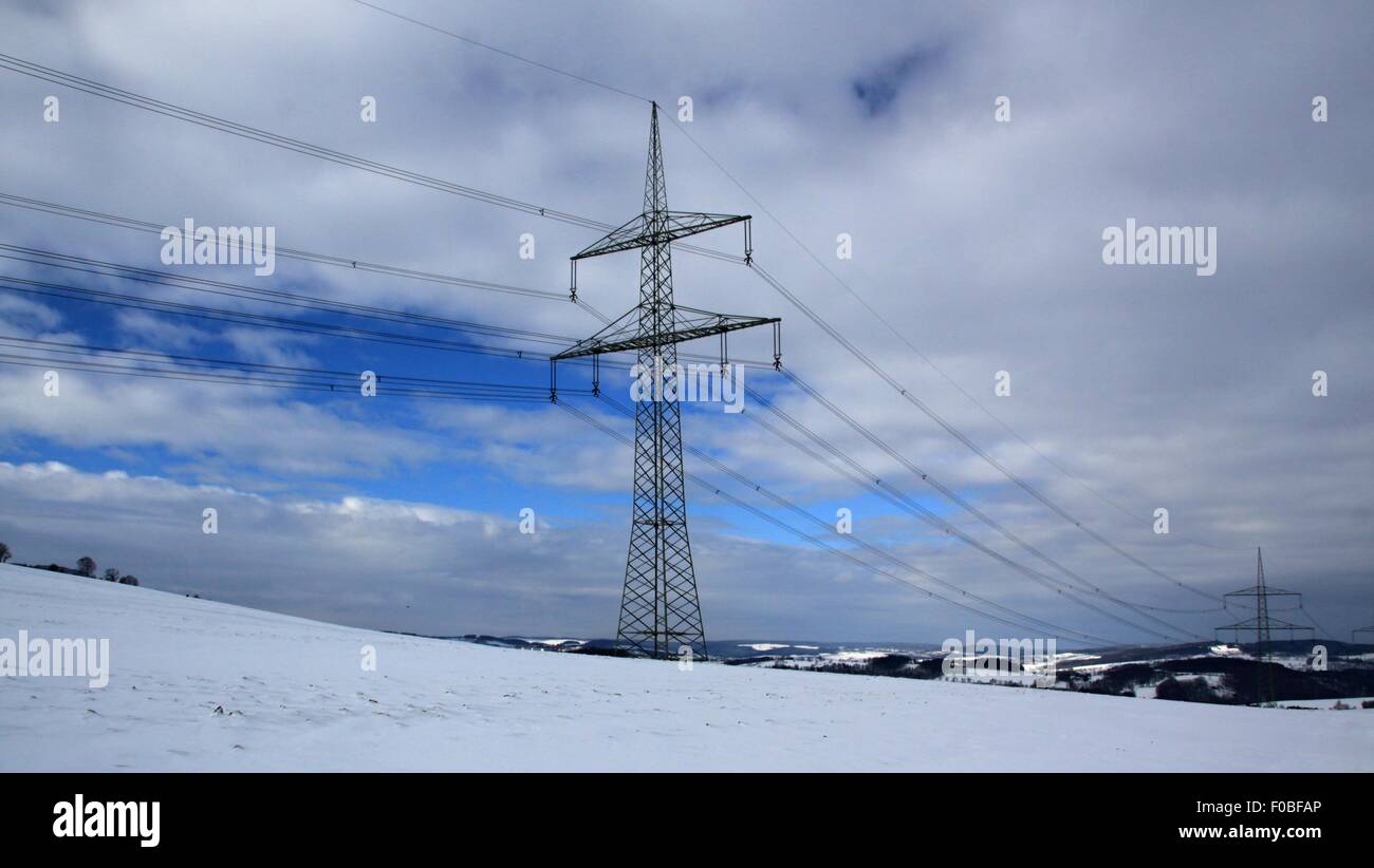 winter landscape and mast electrical wiring and blue sky Stock Photo ...