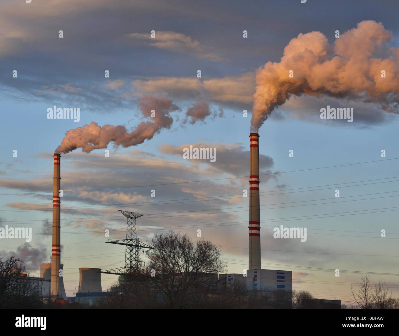 big power plant at sunset with two stacks Stock Photo - Alamy