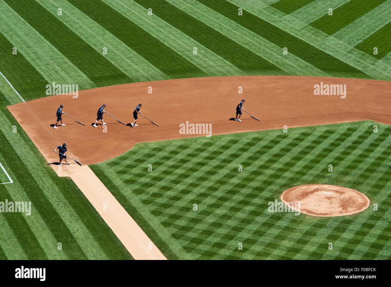 Baseball field abstract patterns with ground crew preparing the field ...