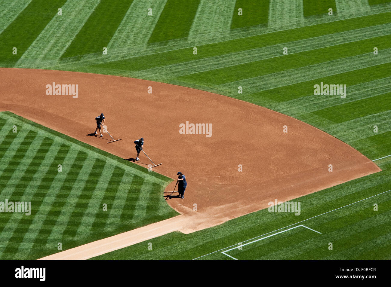 Baseball field abstract patterns with ground crew preparing the field ...