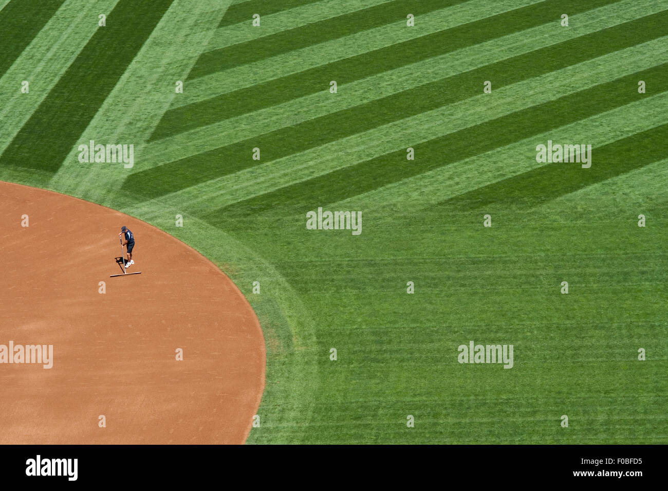 Baseball field abstract patterns with ground crew preparing the field ...