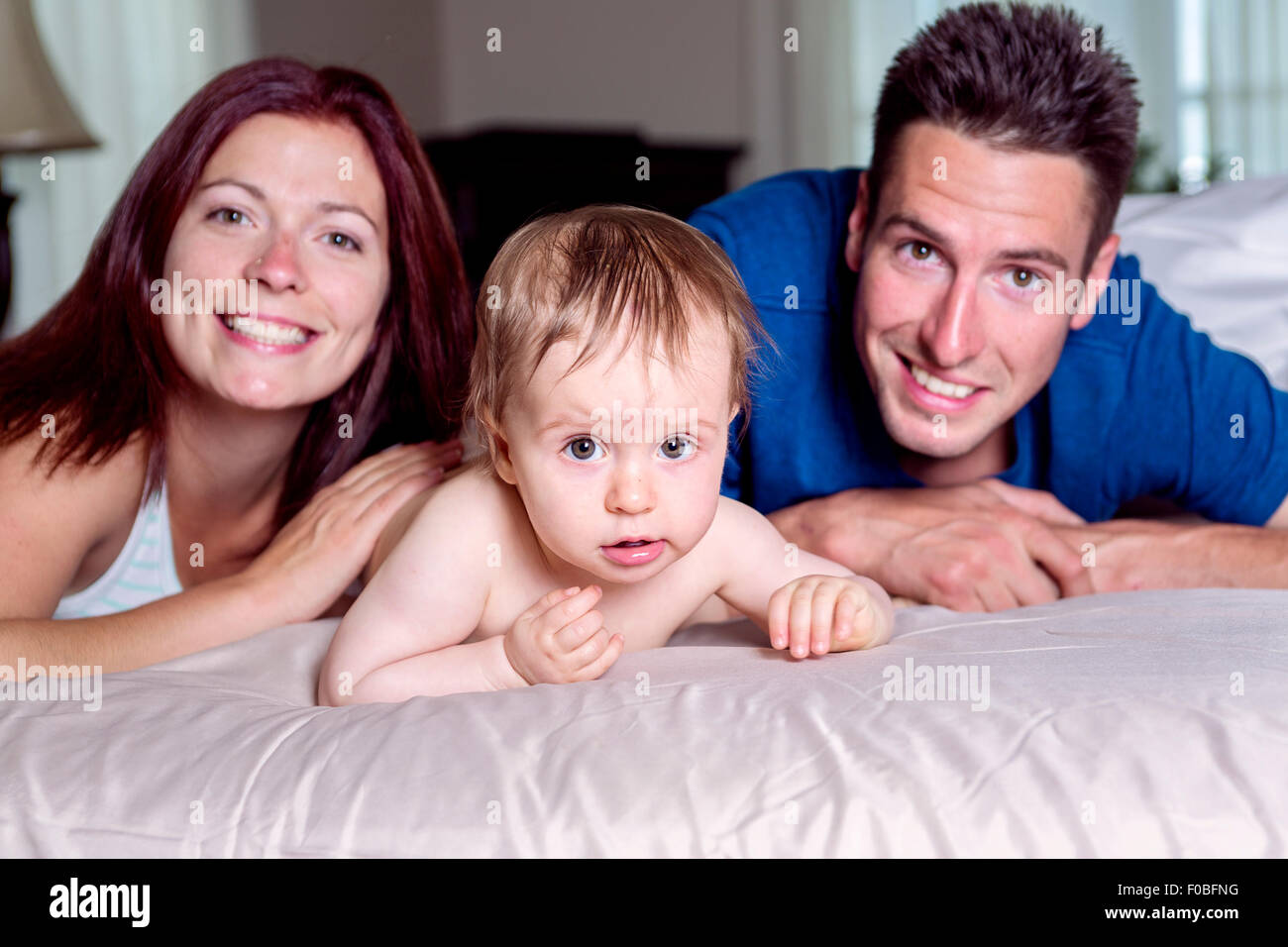 portrait of happy family, beautiful mother and handsome father Stock ...