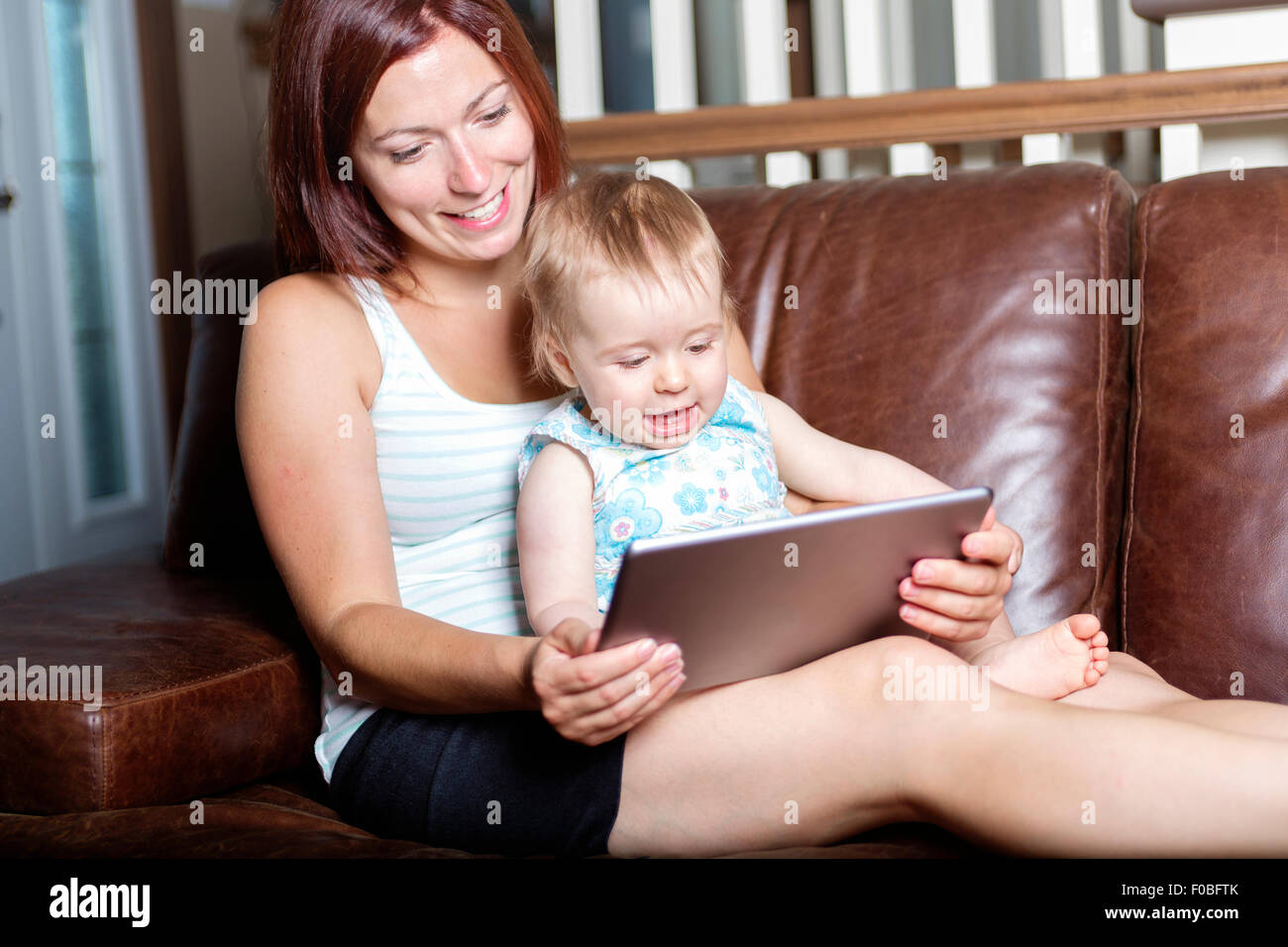 Woman baby computer hi-res stock photography and images - Alamy