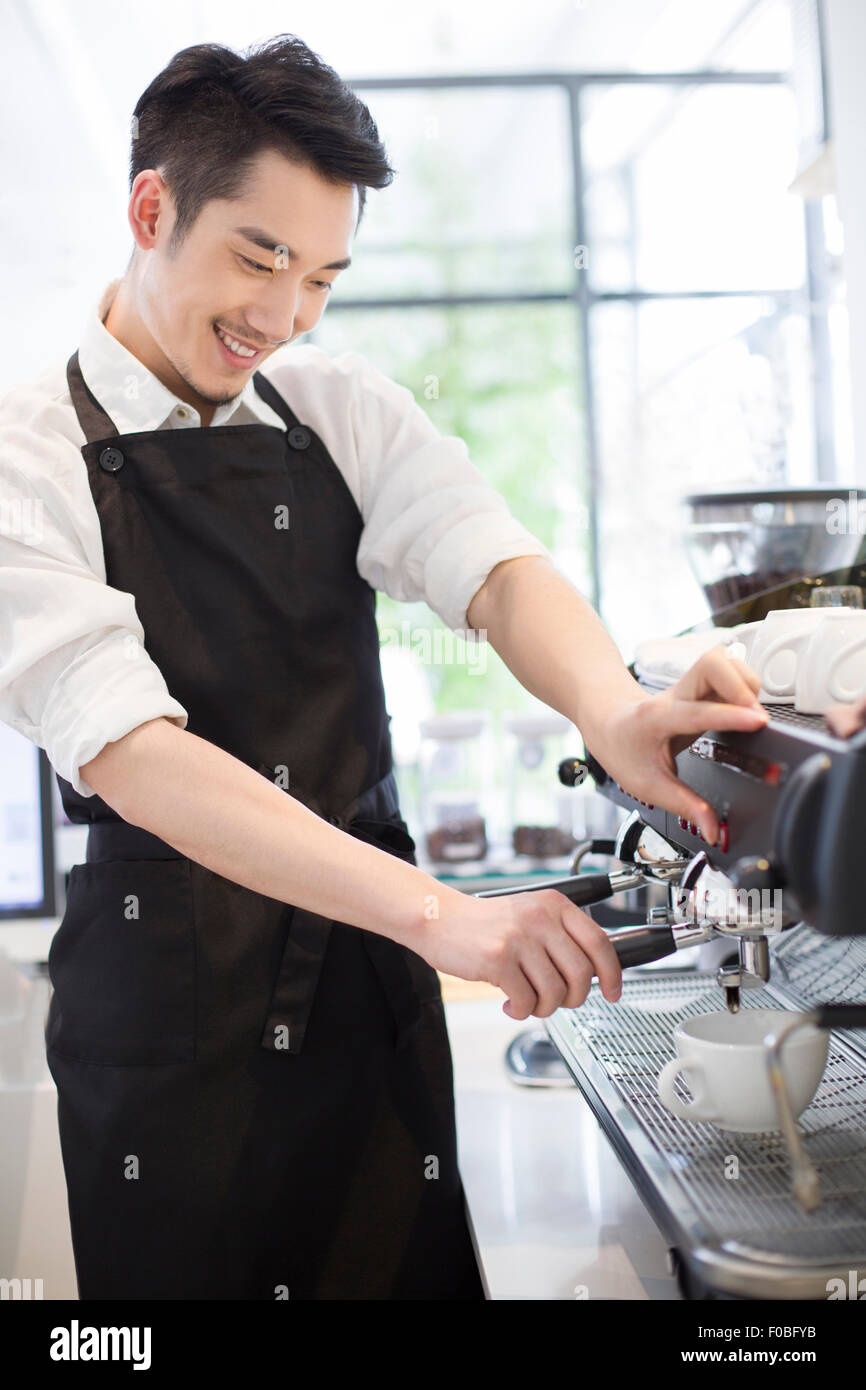 Barista making coffee Stock Photo - Alamy