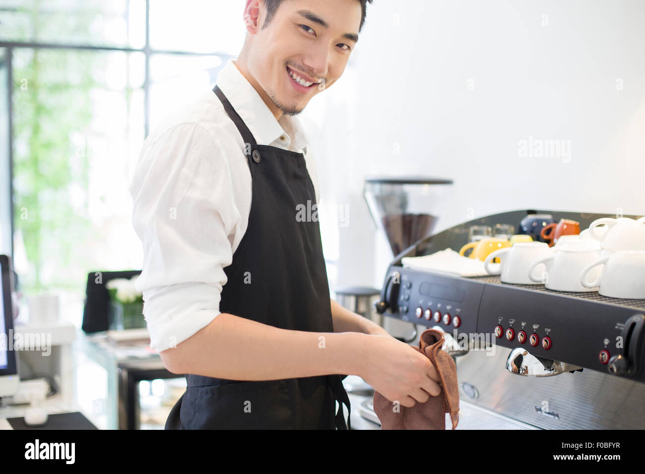 Portrait of barista Stock Photo - Alamy