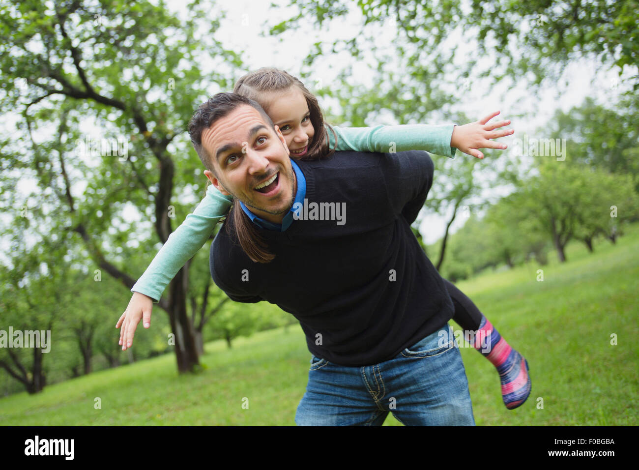 Father and daughter in forest on a meadow Stock Photo - Alamy