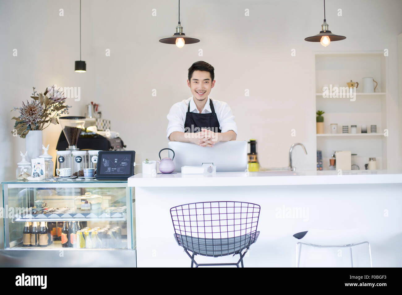 Portrait of coffee shop owner Stock Photo - Alamy