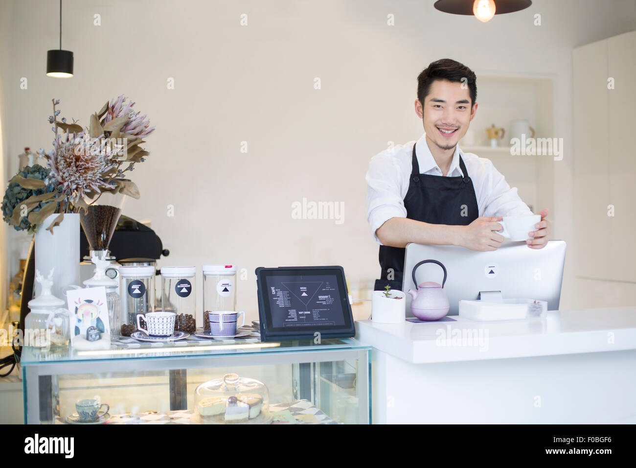 Portrait of coffee shop owner Stock Photo - Alamy