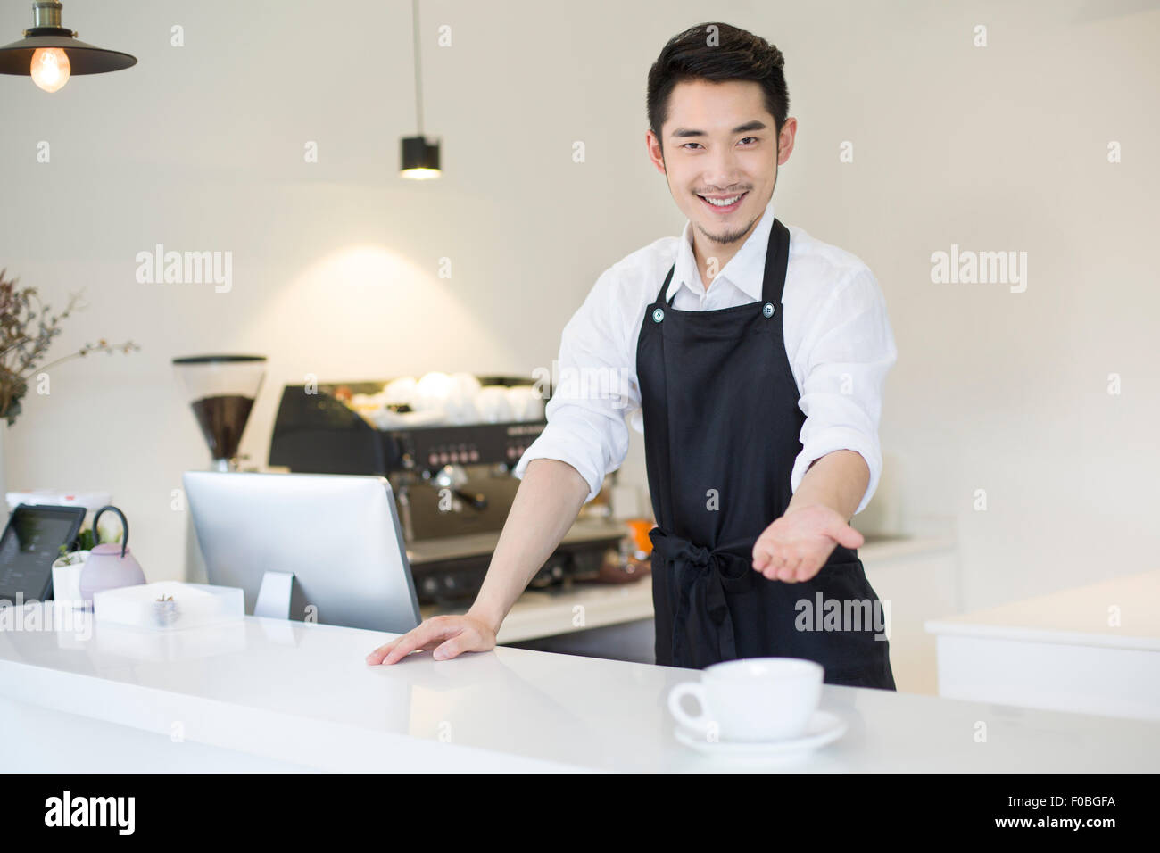 Coffee shop owner working Stock Photo - Alamy