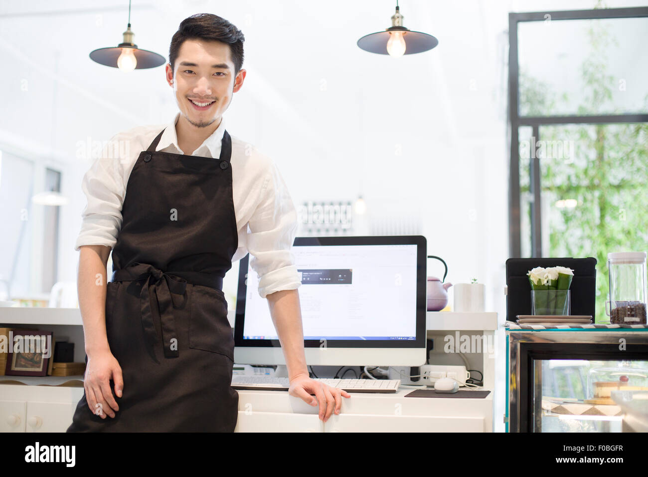 Portrait of coffee shop owner Stock Photo - Alamy