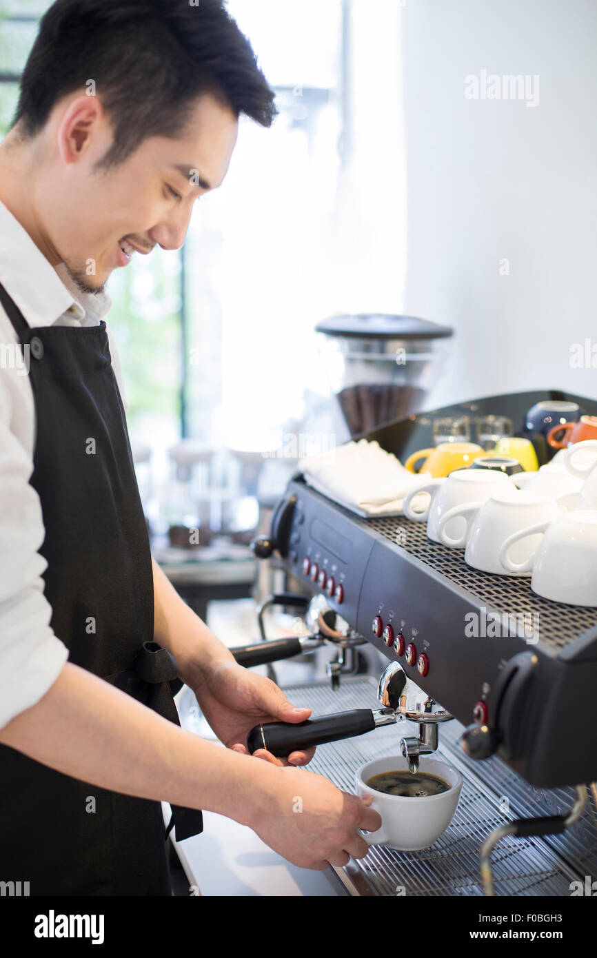Barista making coffee Stock Photo - Alamy