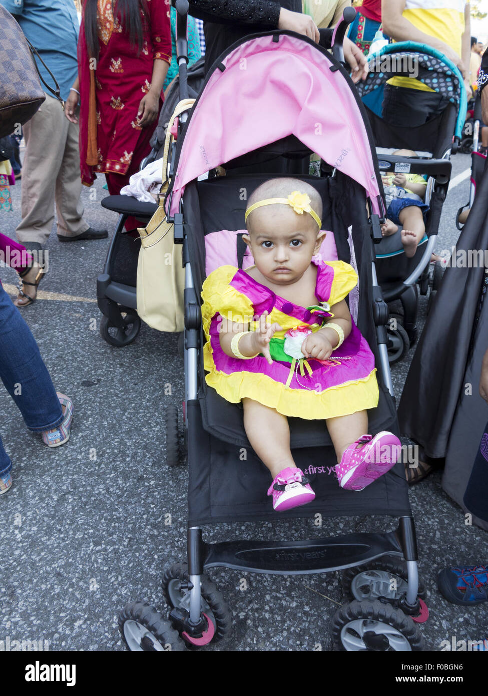 Bangladeshi baby girl in festive dress at street fair in "Little ...