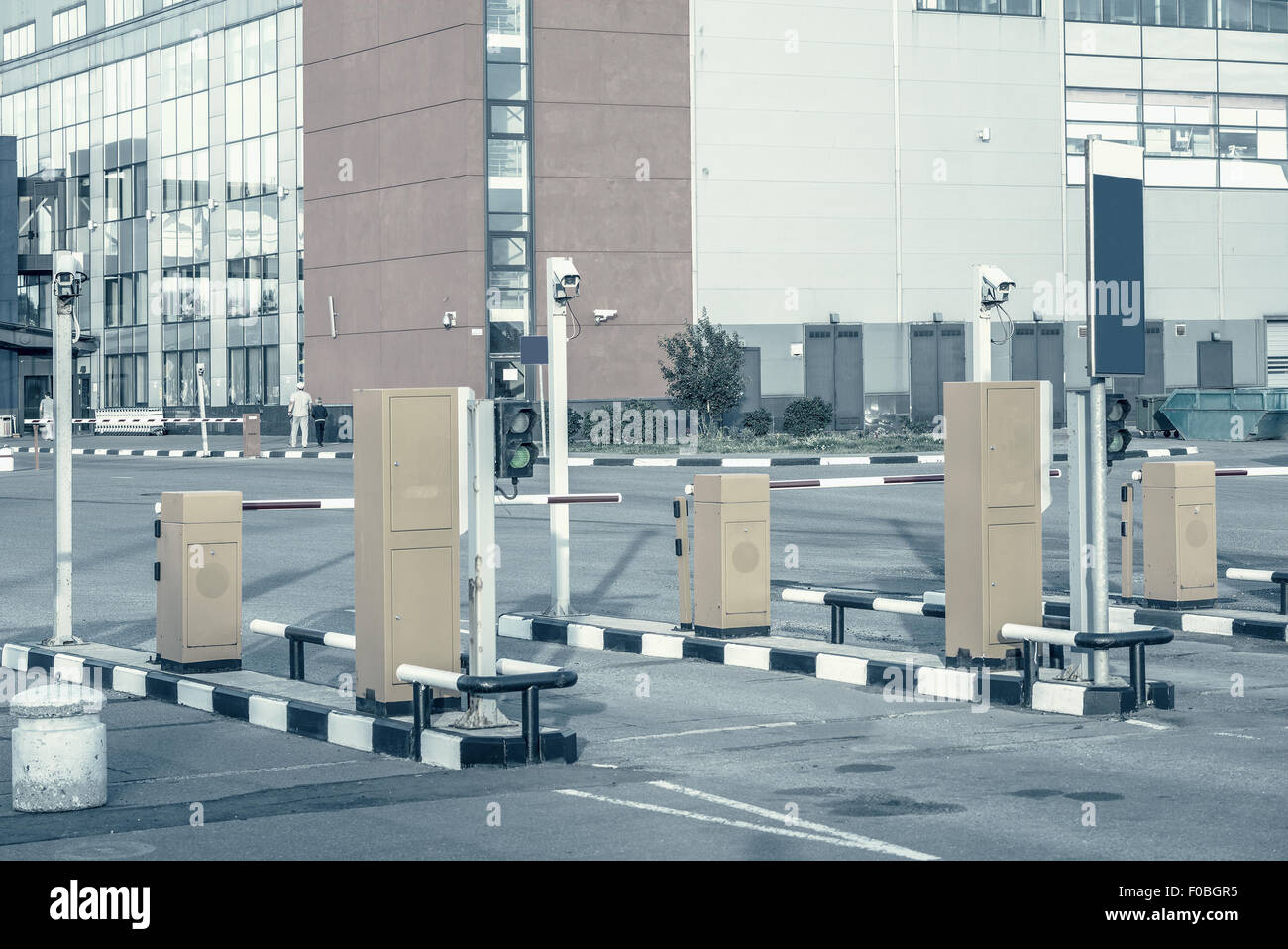 Checkpoint by the car parking in the airport terminal at sunset time ...