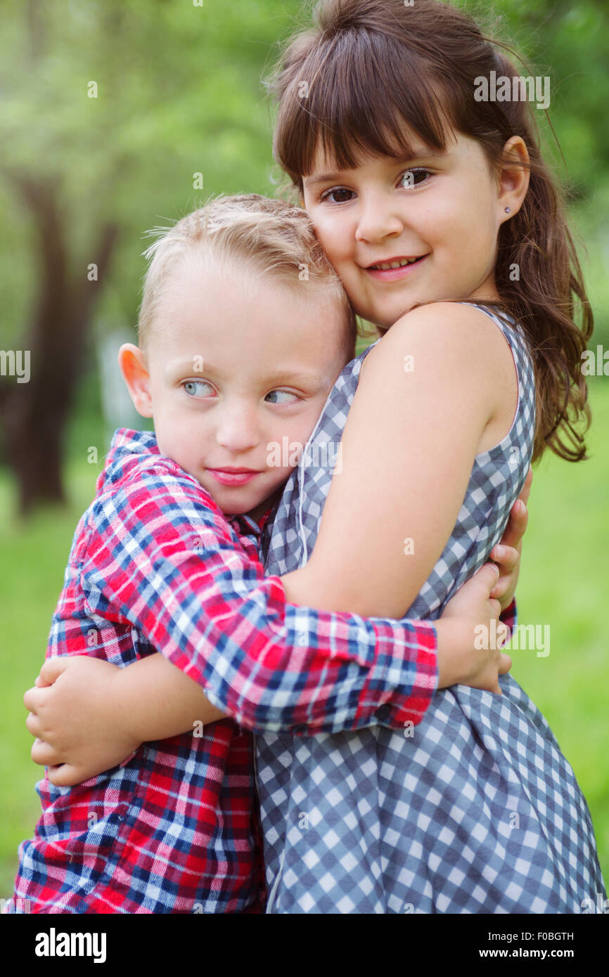 image of two happy children having fun in the park Stock Photo - Alamy