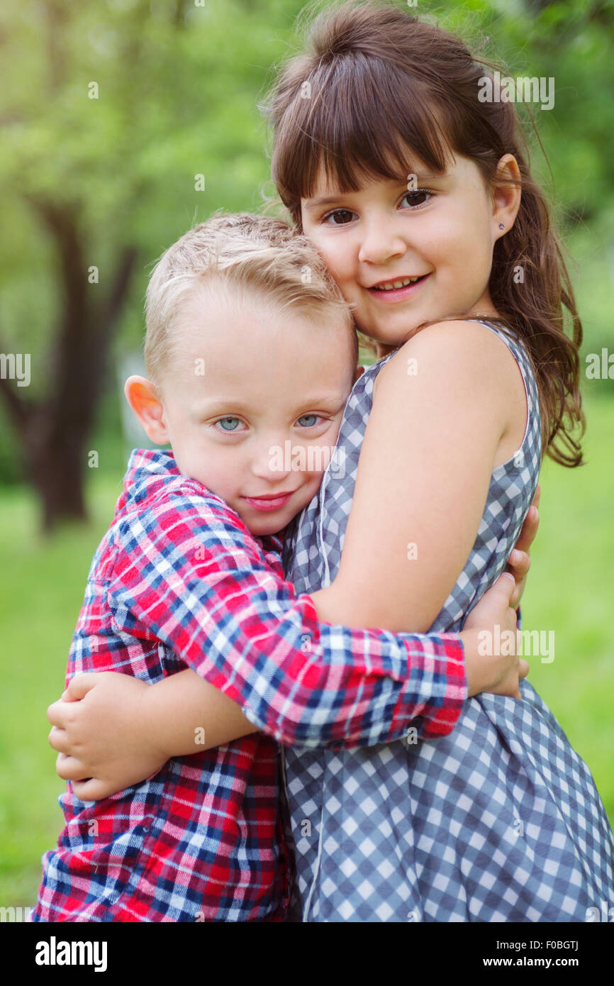 image of two happy children having fun in the park Stock Photo - Alamy