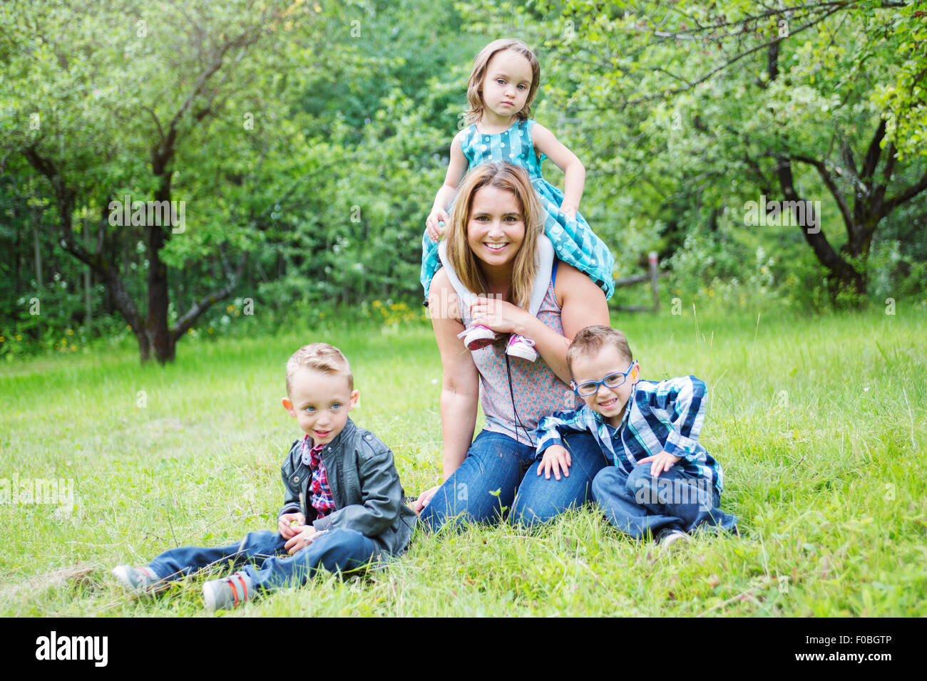 family in forest having fun together Stock Photo - Alamy