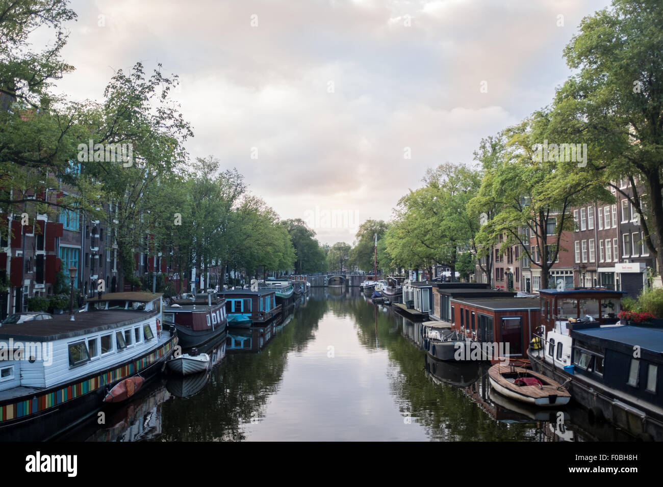 Canal view in Amsterdam city centre in Holland Stock Photo - Alamy