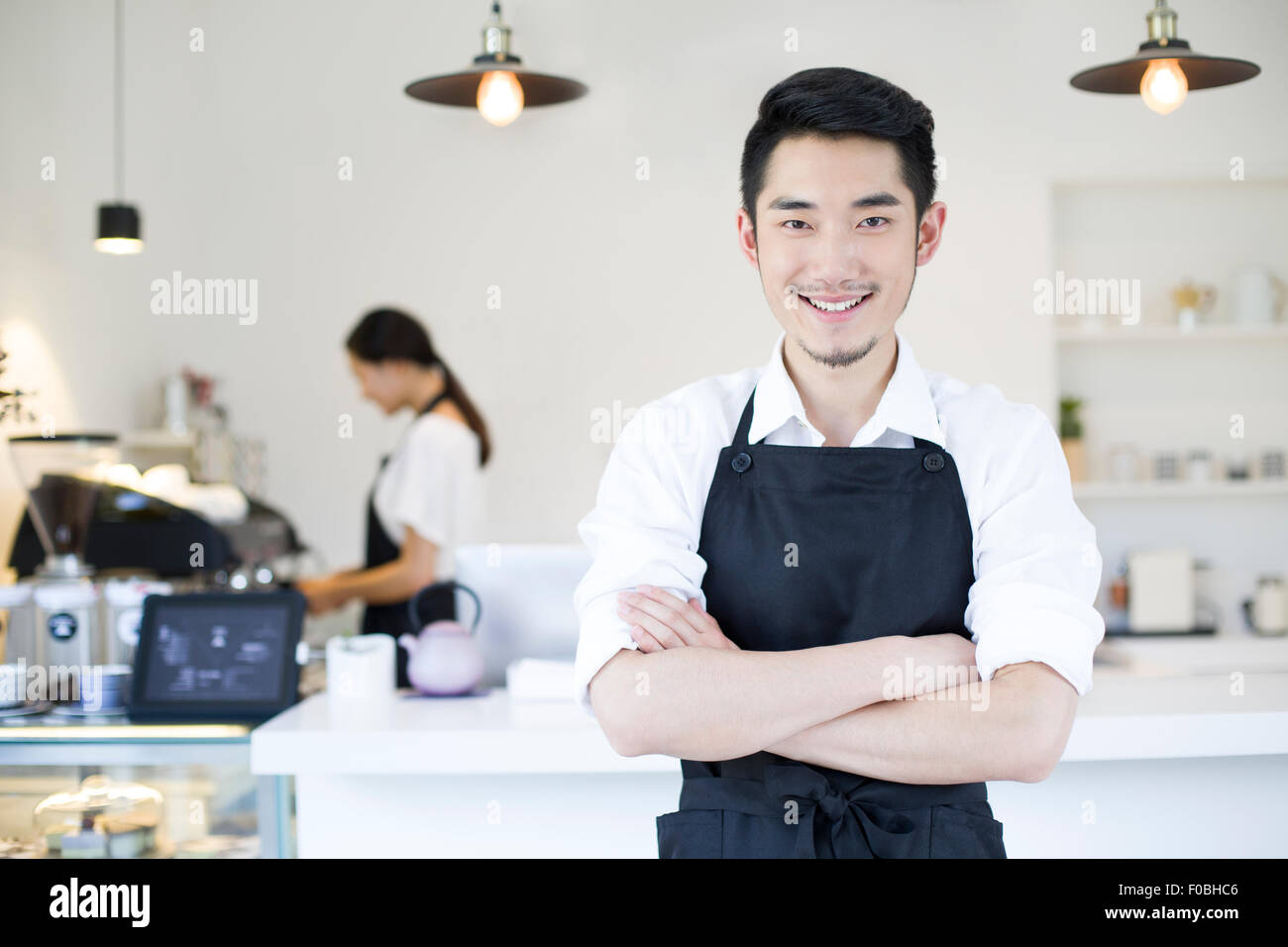 Portrait of coffee shop owner Stock Photo - Alamy