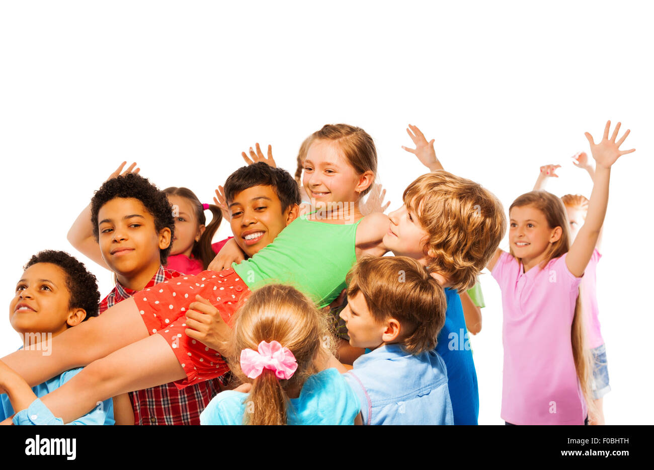 Croup of kids carry girl on hands Stock Photo - Alamy